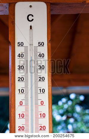 View of outdoor thermometer. Extreme temperature in the shade. 42 ...