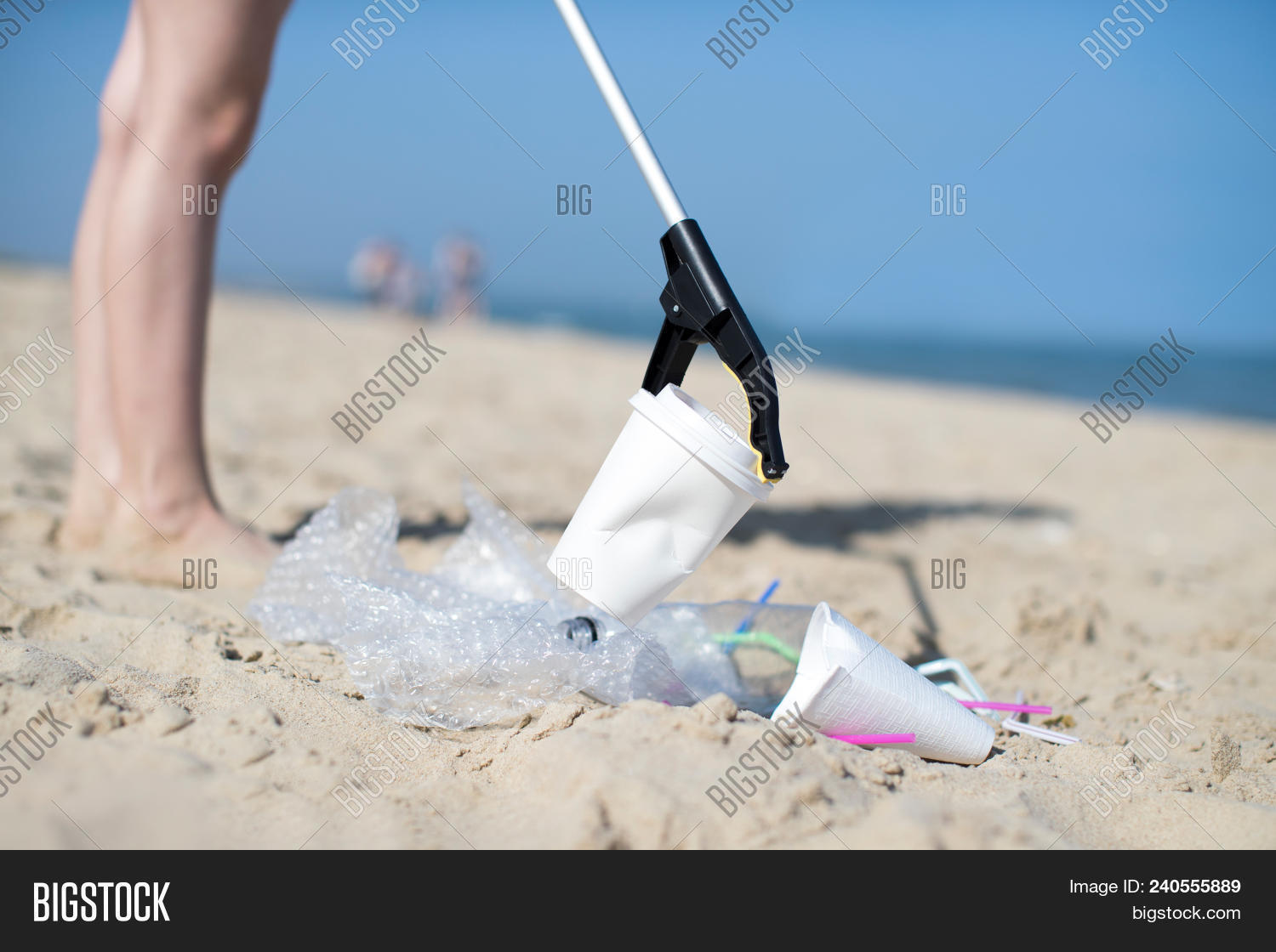 Close Up Of Person Collecting Plastic Waste From Polluted Beach Using ...