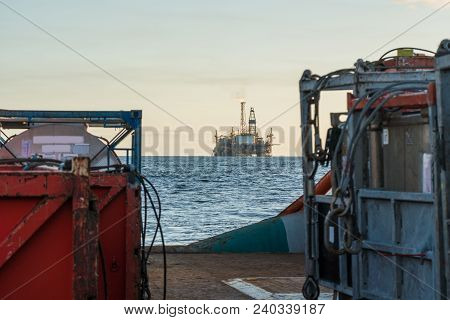 Offshore Supply Boat With Containers And Tanks Onboard Delivers Cargo ...
