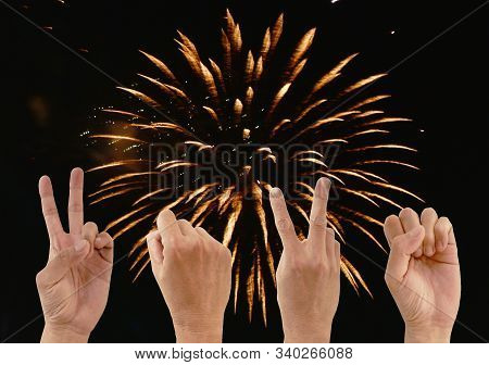 Hand Sign Year 2020 On Fireworks Explosive In Night Background image ...