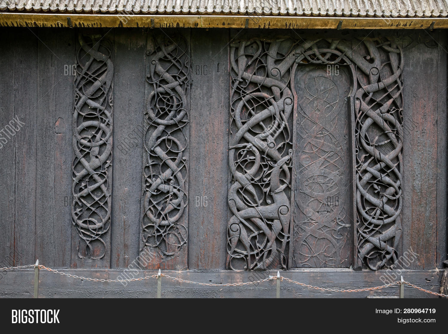 11-th century wooden carvings on wall planks and door jambs of Urnes ...