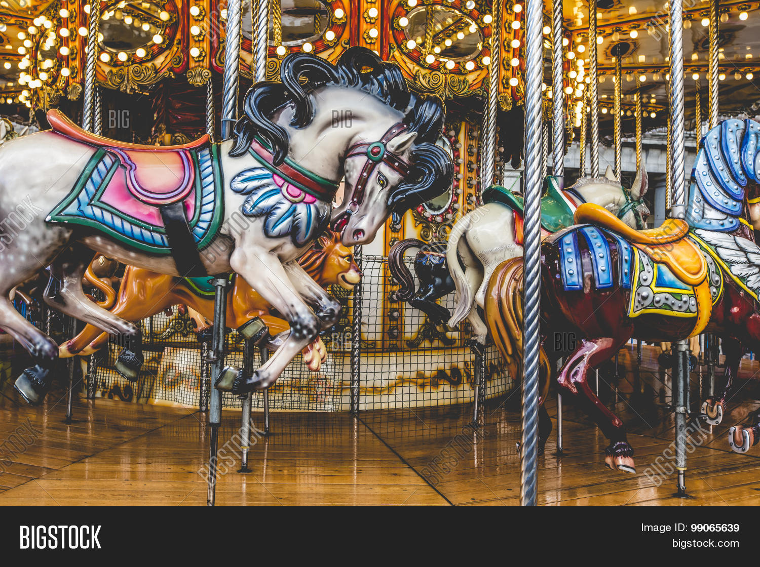 Old French Carousel In A Holiday Park. Three Horses And Airplane On A ...