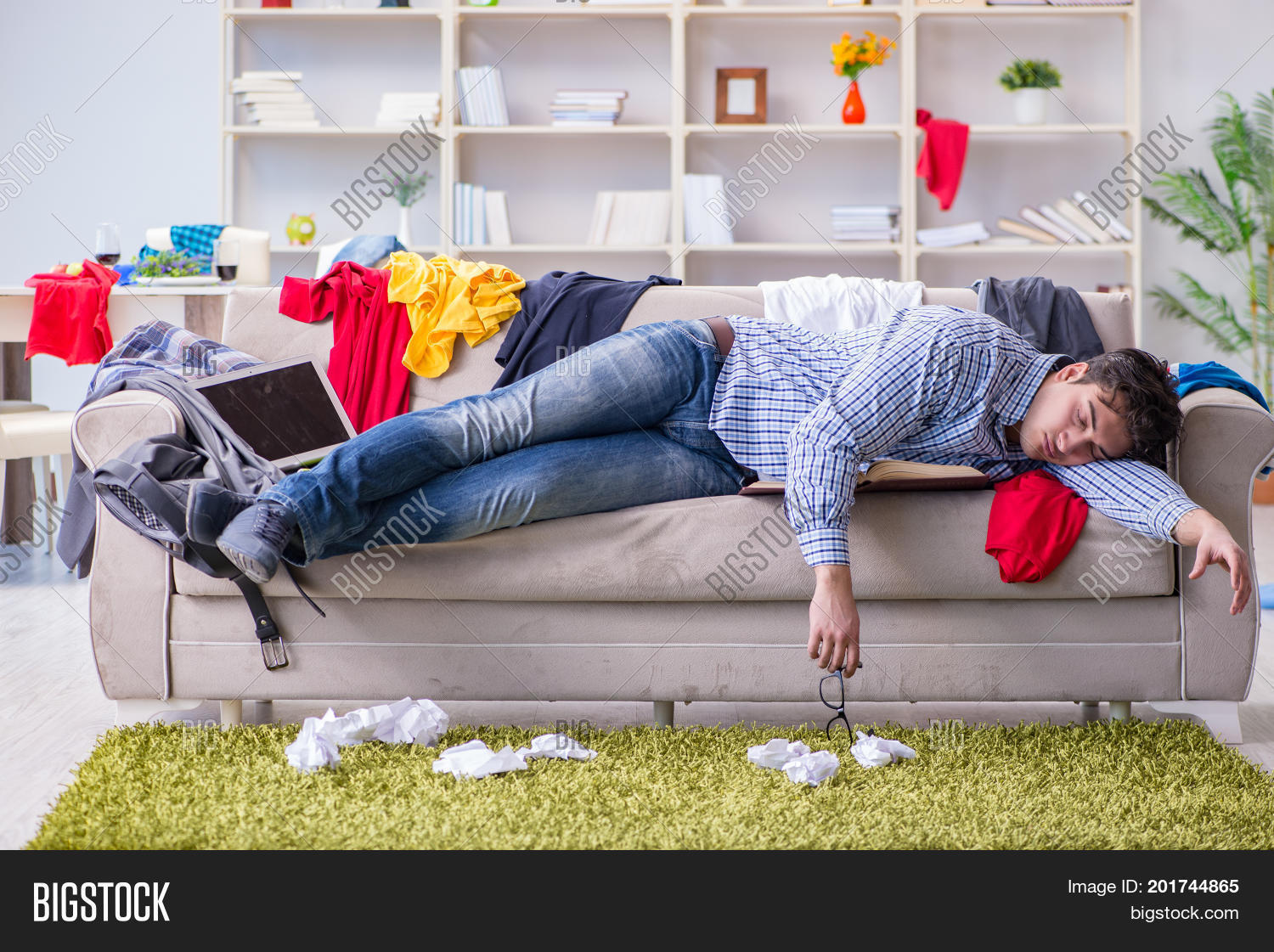Young man working studying in messy room image & stock photo. 201744865
