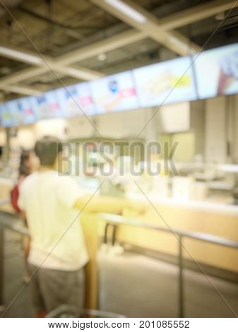 Blurred Image Of People Queue Up Waiting In Line To Buy Fast Food In ...