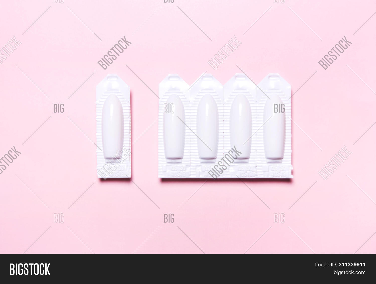 Suppository On A Pink Background, For The Treatment Of Hemorrhoids ...