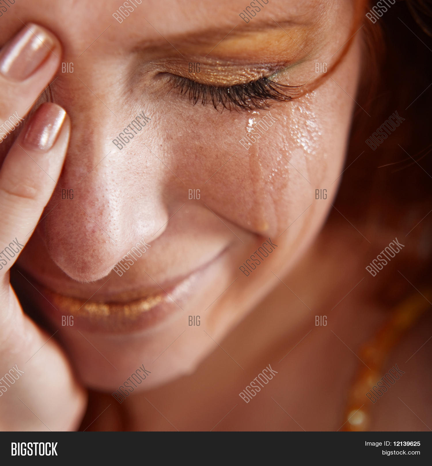 Closeup of crying woman with tears image & stock photo. 12139625