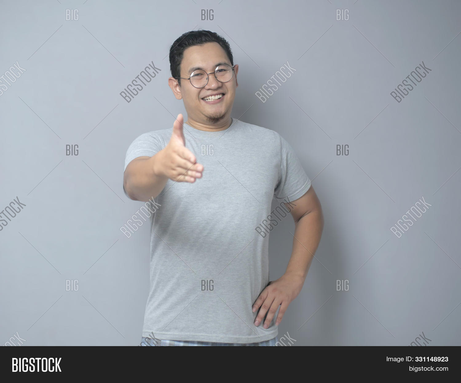 Portrait Of Good Looking Young Asian Man Shows Hand Shake Offer Gesture ...