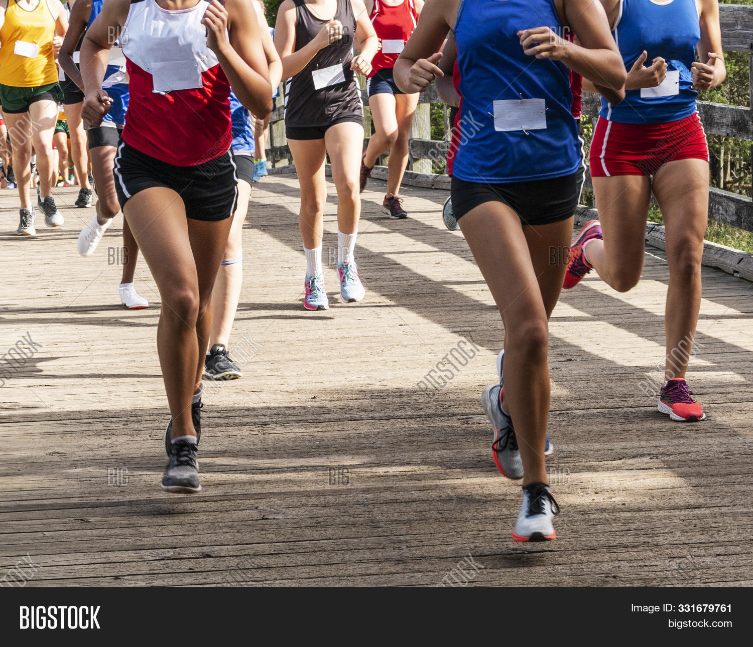 Many High School Girls Running In A Cross Country 5k Race Crossing Over ...