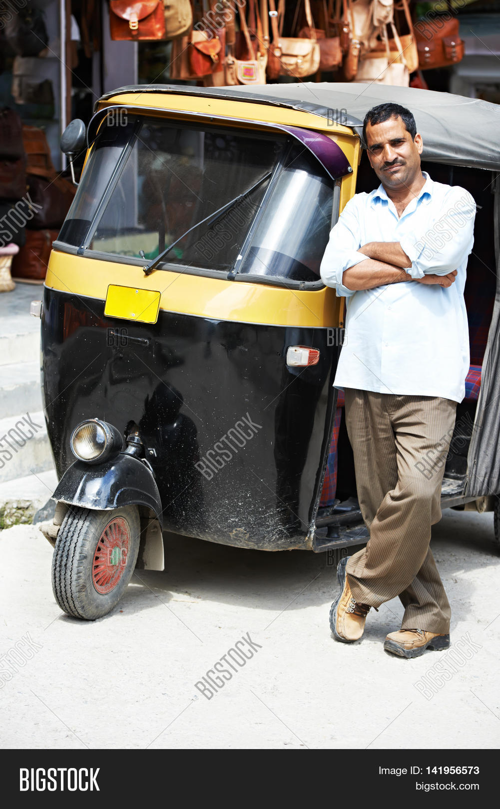 Indian auto rickshaw tut-tuk driver man image & stock photo. 141956573
