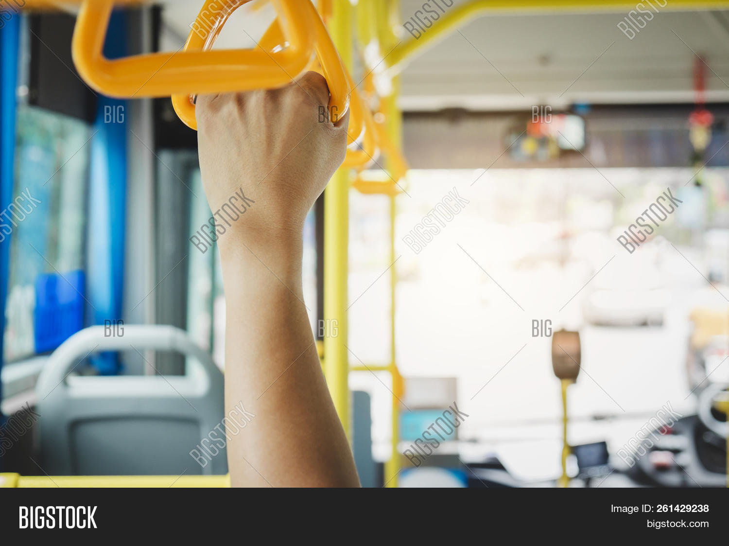 People Hand Holding Handles For Standing Passenger In The City Bus ...