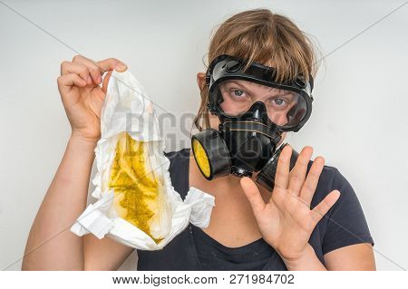 Mother With Gas Mask Changing Smelly Diaper - Baby Care Concept image ...