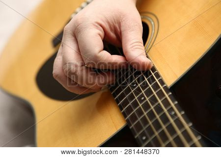Playing Guitar. The Hands Of A Guitarist Closeup And Classic Six-string ...