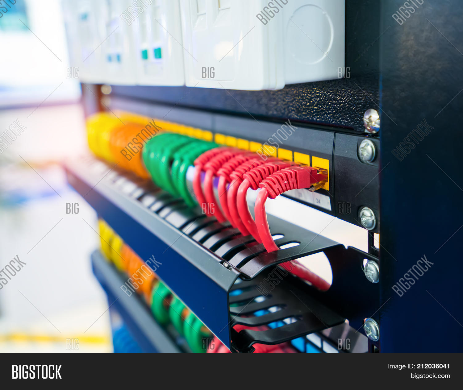 Server rack with internet patch cord cables connected to patch panel in ...