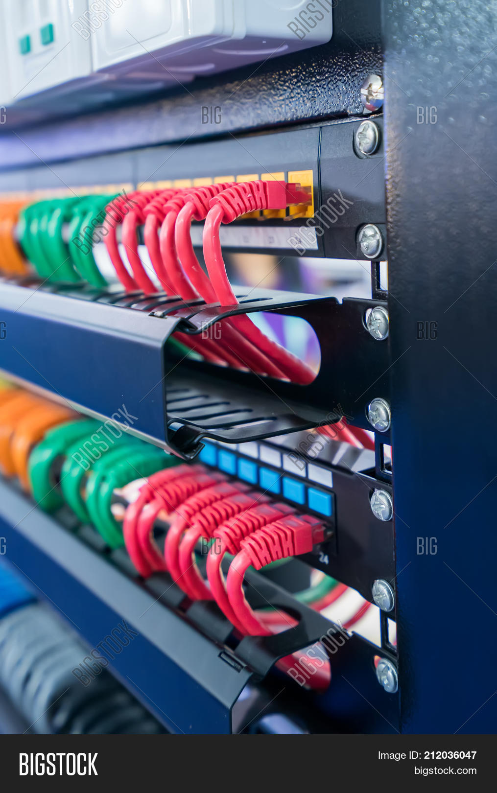 Server rack with internet patch cord cables connected to patch panel in ...