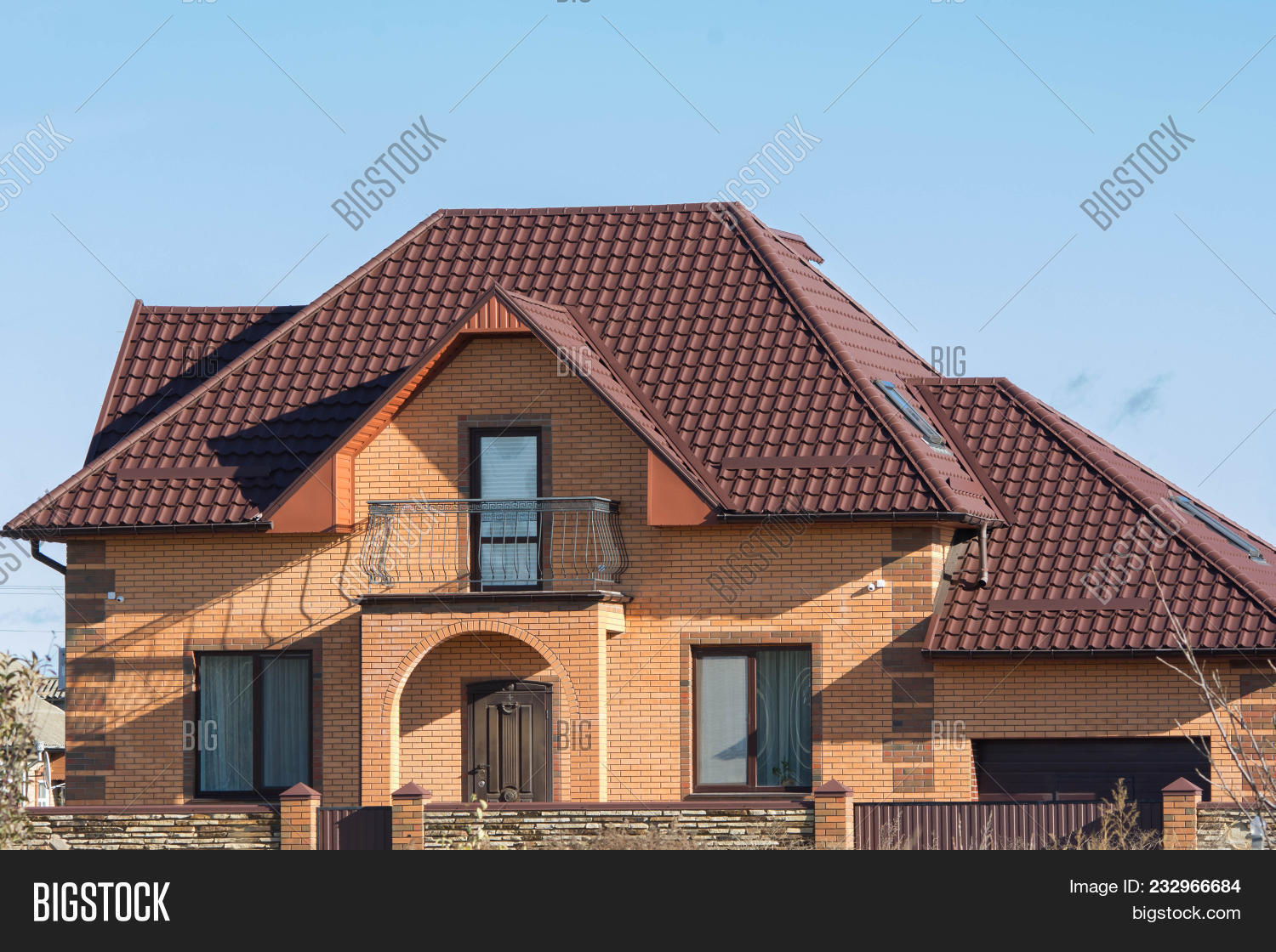 Modern Multilevel Rooftop Of Brick Mansion. Balcony, Snow Guards And ...