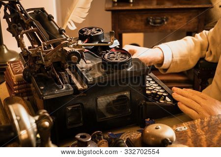 Vintage Antique Typewriter With Pipe On The Old Table And Hand Of Old ...