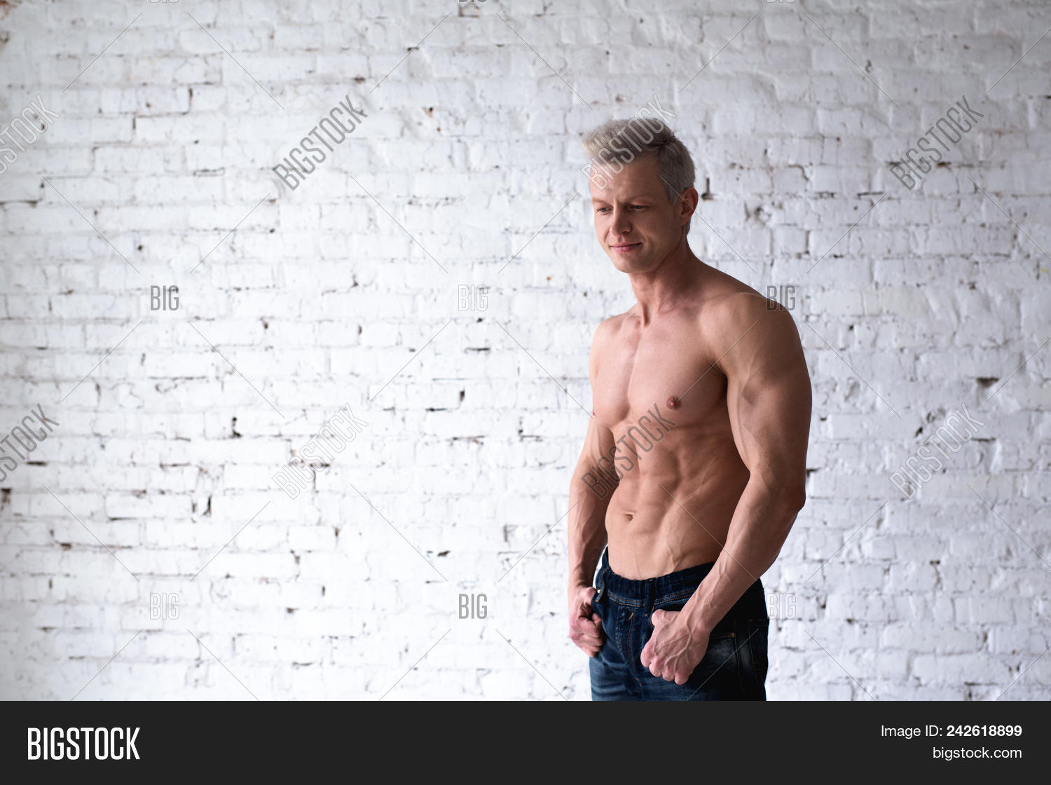 Portrait Of Shirtless Muscular Man In A Jeans. Young Male Hunk Showing ...
