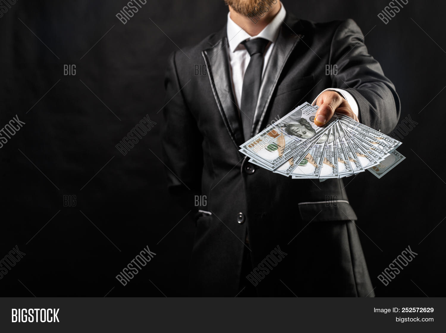Man Holding Money In Hand At Black Background image & stock photo ...