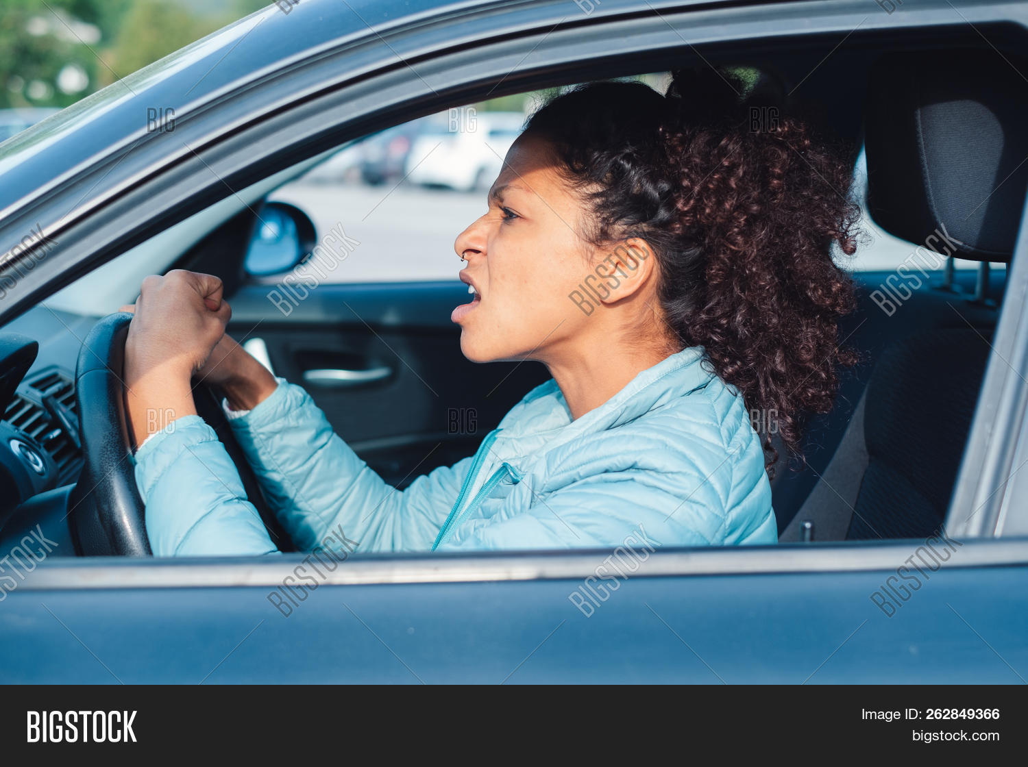 Rude Black Woman Driver Arguing And Driving Car image & stock photo ...