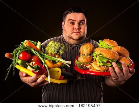 Diet fat man who makes choice between healthy and unhealthy food ...