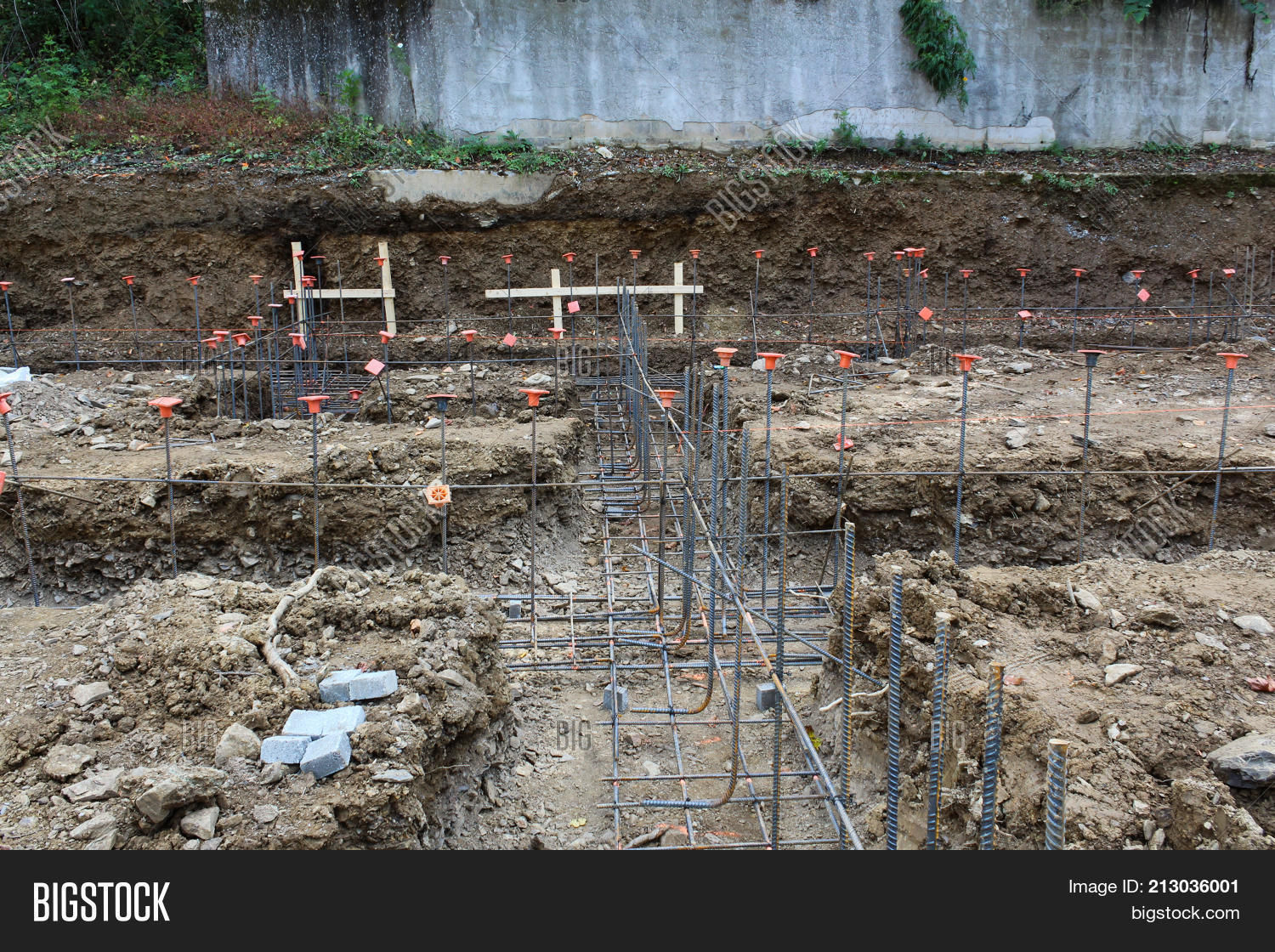 Construction Site View Over Unpoured Footings With Steel Rebar Gridwork ...