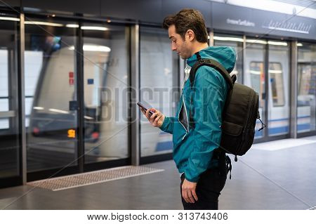 Young Traveler Reading Social Network On Cell Phone On Subway Metro ...