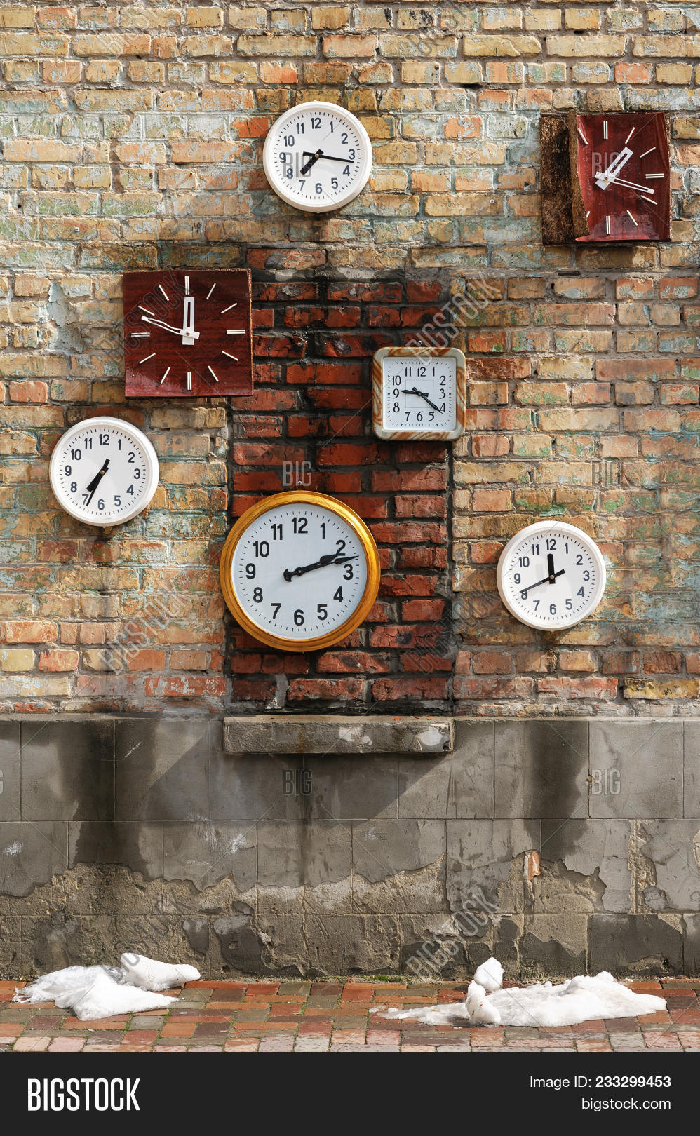 Wall Clock On A Brick Wall. Many Different Hours. Collection Of Wall ...