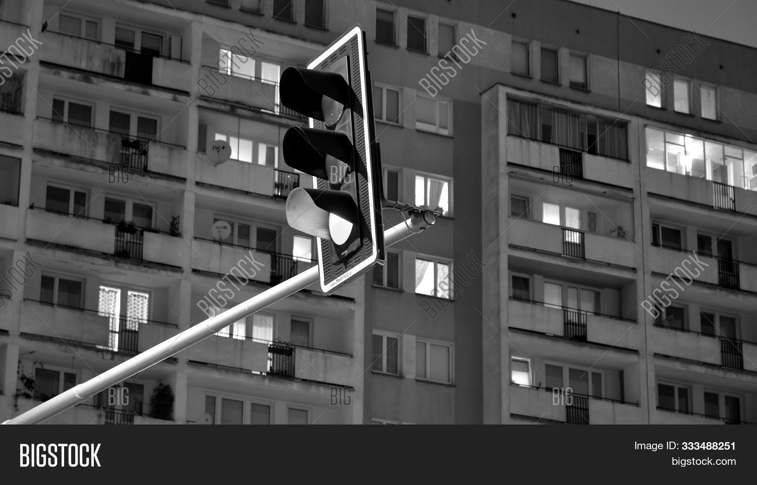 Exterior Of Apartment Building At Night With Light From Windows. Street ...