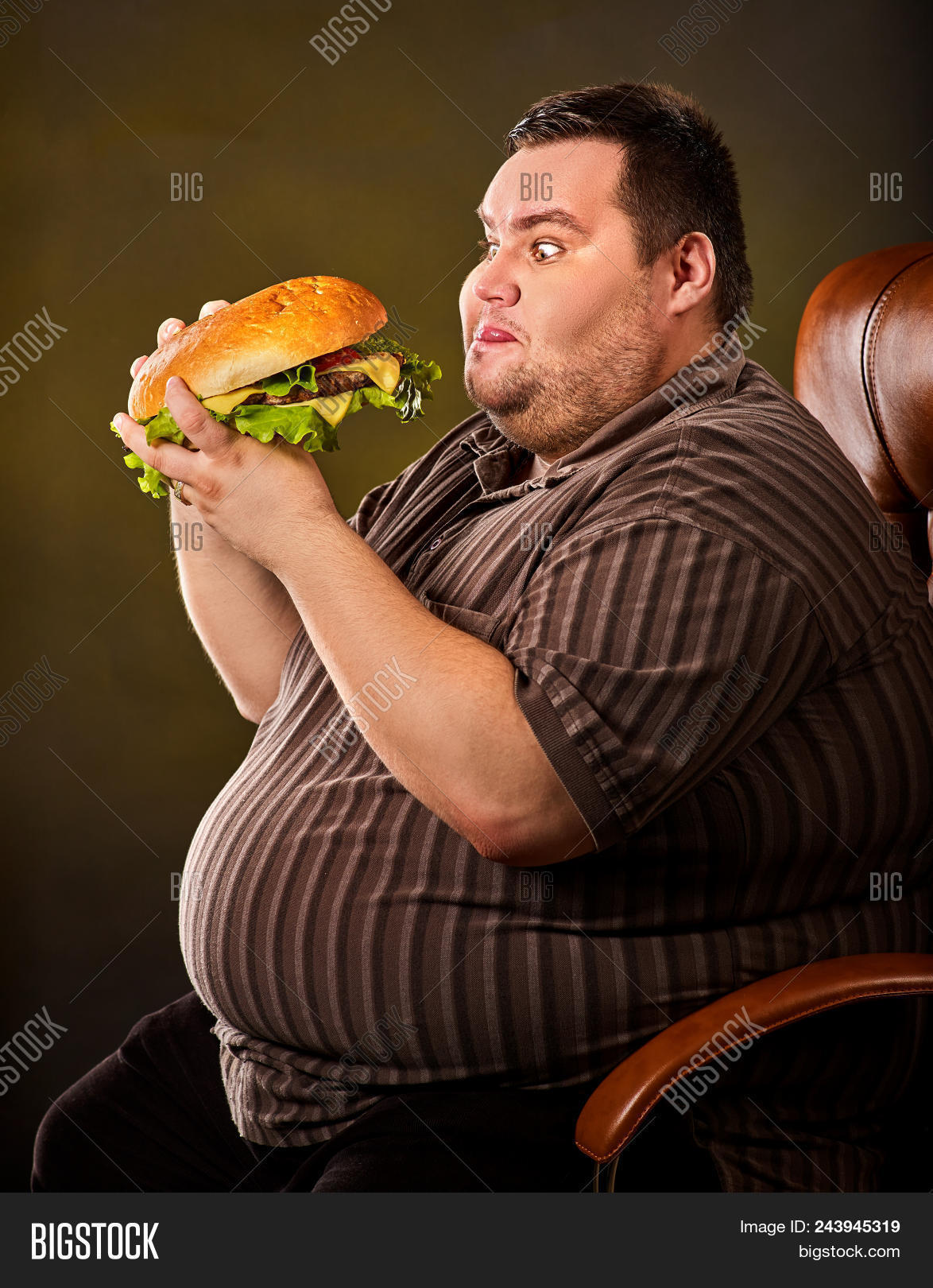 Diet failure of fat man eating fast food hamberger. Breakfast for ...