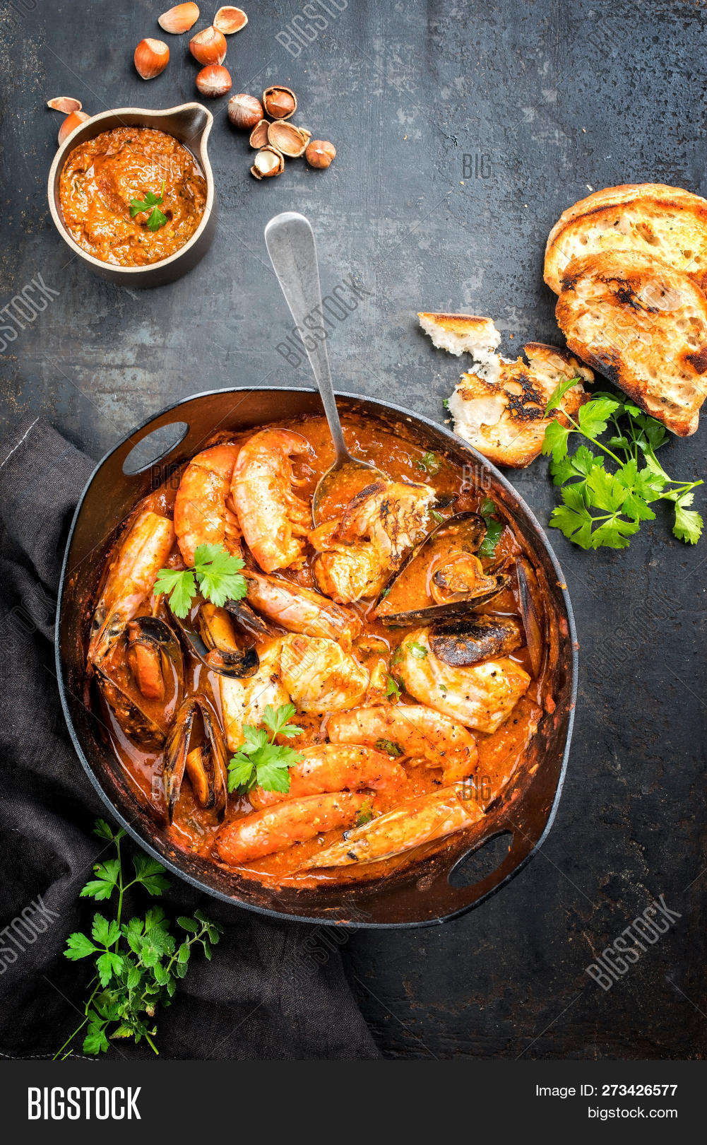 Traditional Catalan fish stew romesco de peix with prawns, mussels and ...