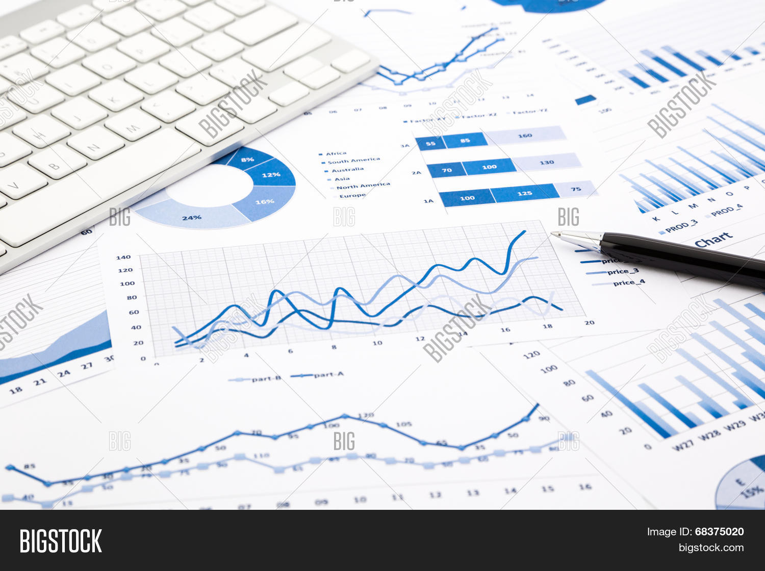Blue Graph And Chart Reports On Office Table image & stock photo. 68375020