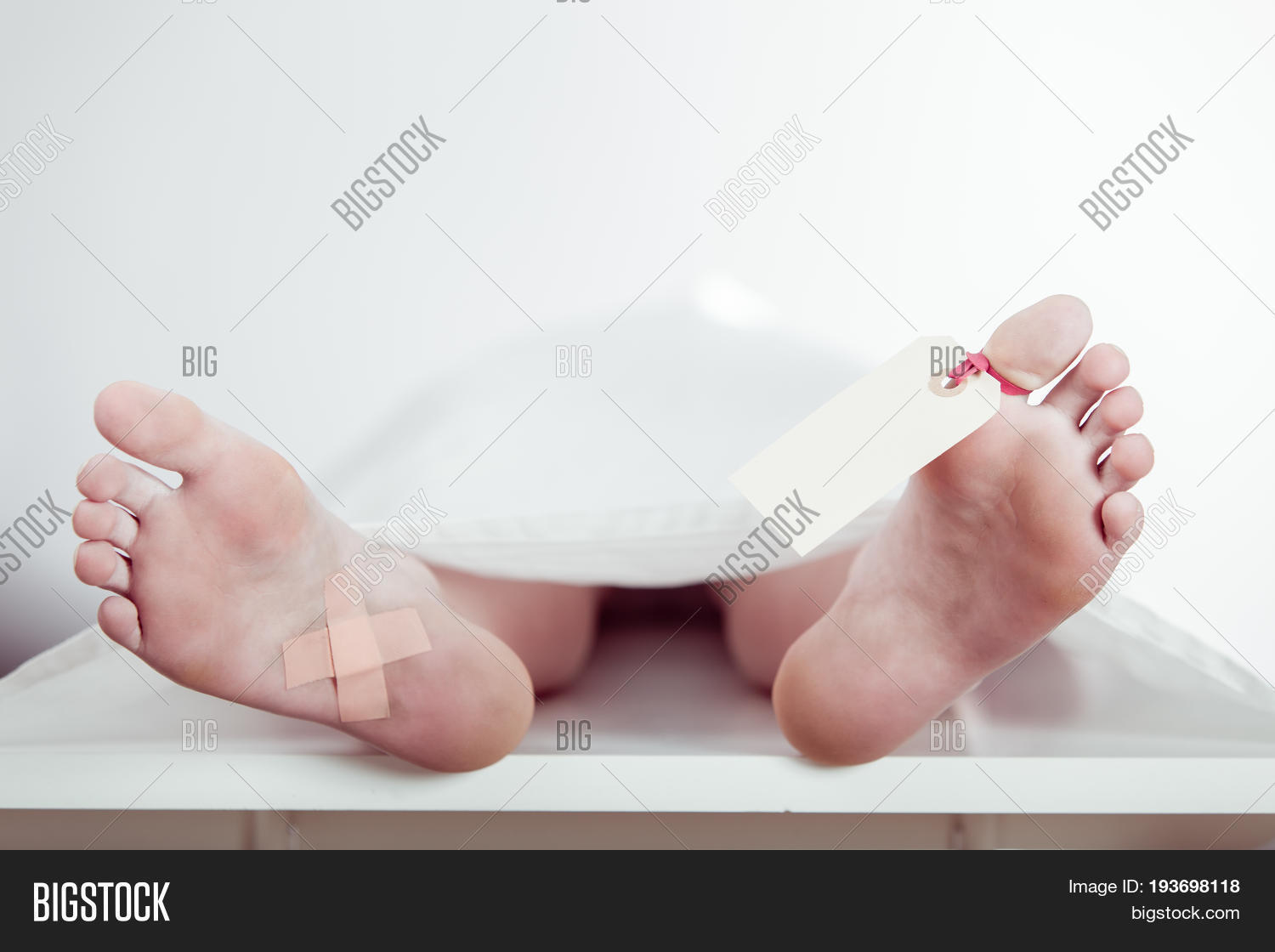 Boy Lying On A Mortuary Slab With A Tag On His Toe image & stock photo ...