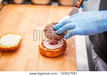 Chief Cook Preparing Fresh Burger In The Kitchen.burger Restaurant Menu ...