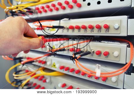 Adjustment fiber optical switch with connected FC cables in server room ...