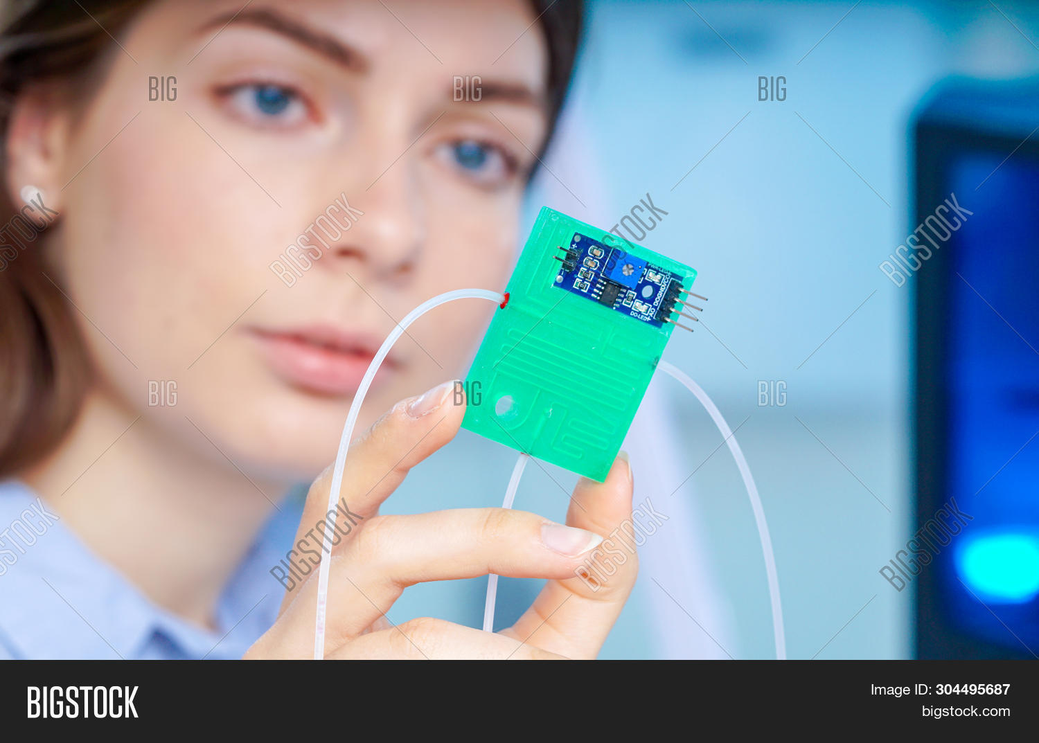 Girl holding polymers Bio-MEMS biomedical microelectromechanical ...