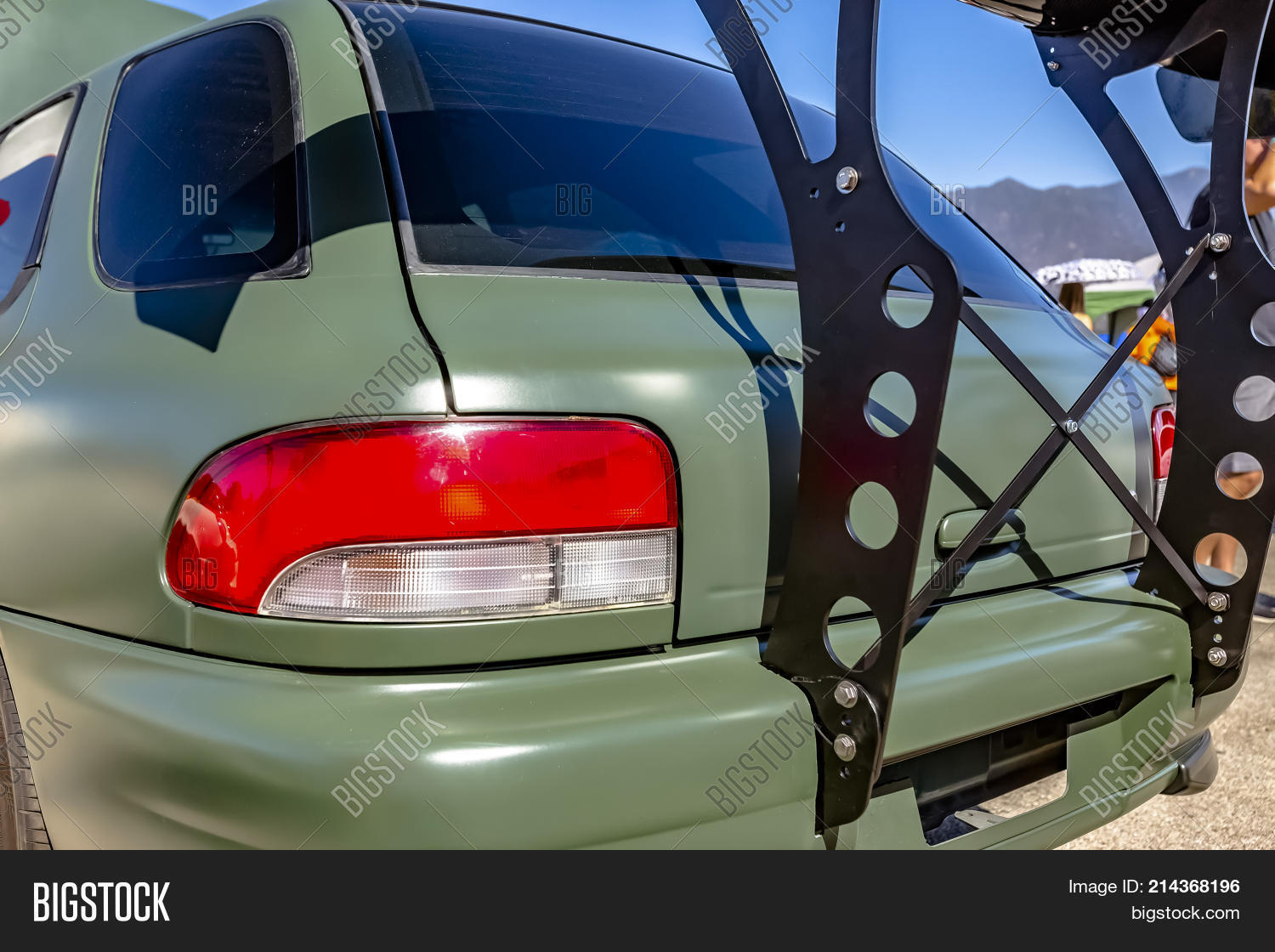 Rear Spoiler Built On A Flat Green Car image & stock photo. 214368196