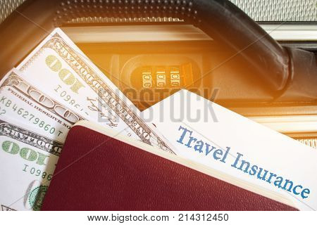 Travel Insurance tag on suitcase near numeric combination lockpassport ...