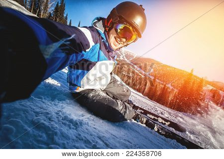 Selfie Guy sportsman goes on normal skiing on ski slope with action ...