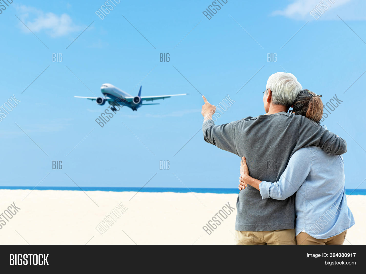 Asian Lifestyle Senior Couple Hug And Pointing The Landing Planes Or ...
