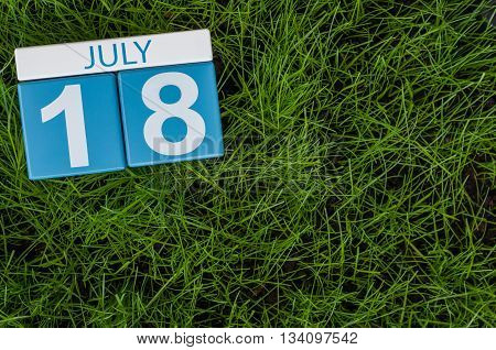 July 18th. Image of july 18 wooden color calendar on greengrass lawn ...