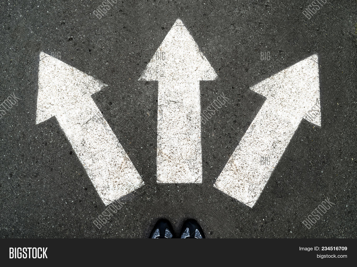 Three White Arrows Pointing In Different Directions On Gray Asphalt ...