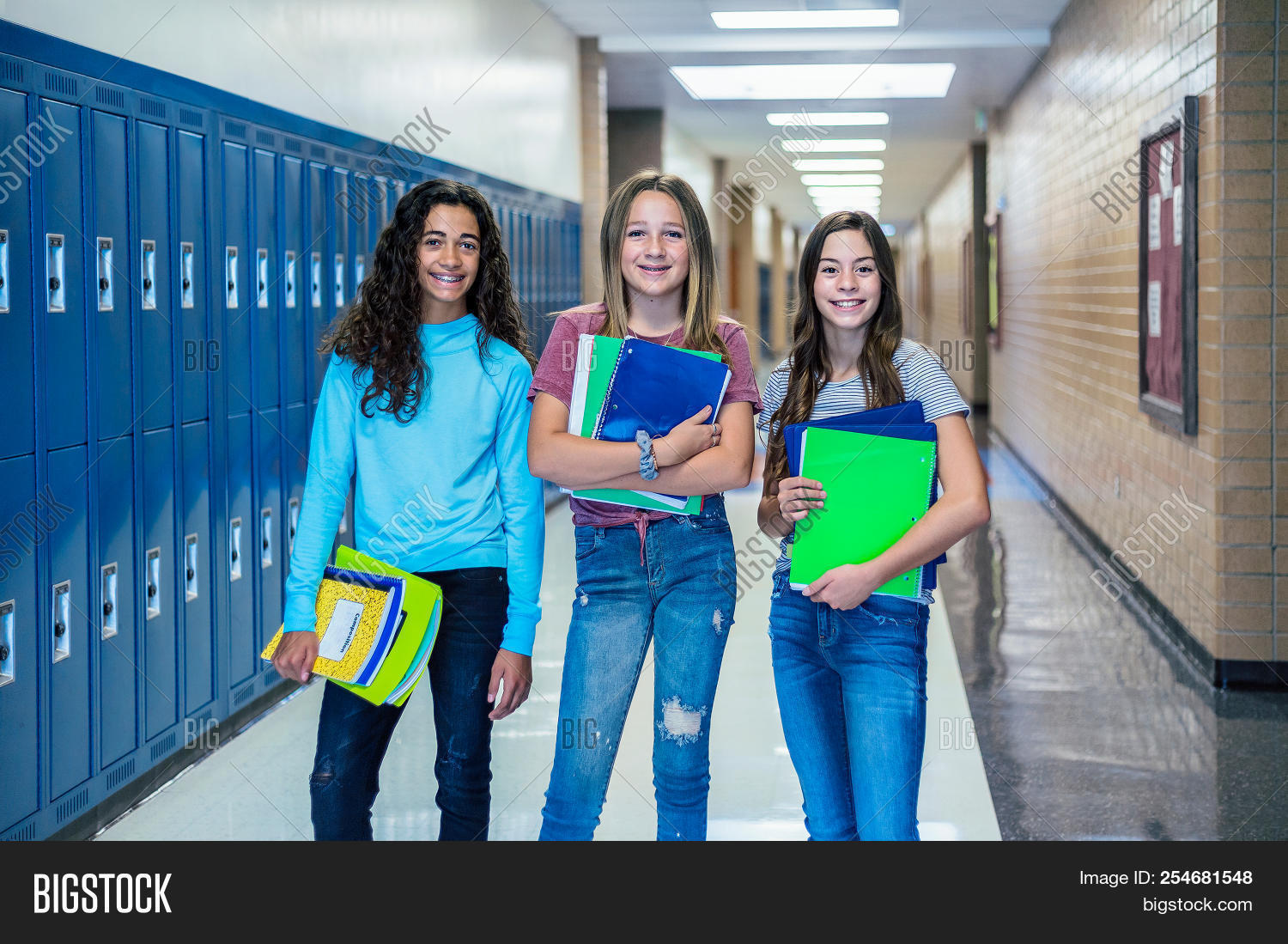 Group of Junior High school Students standing together in a school ...