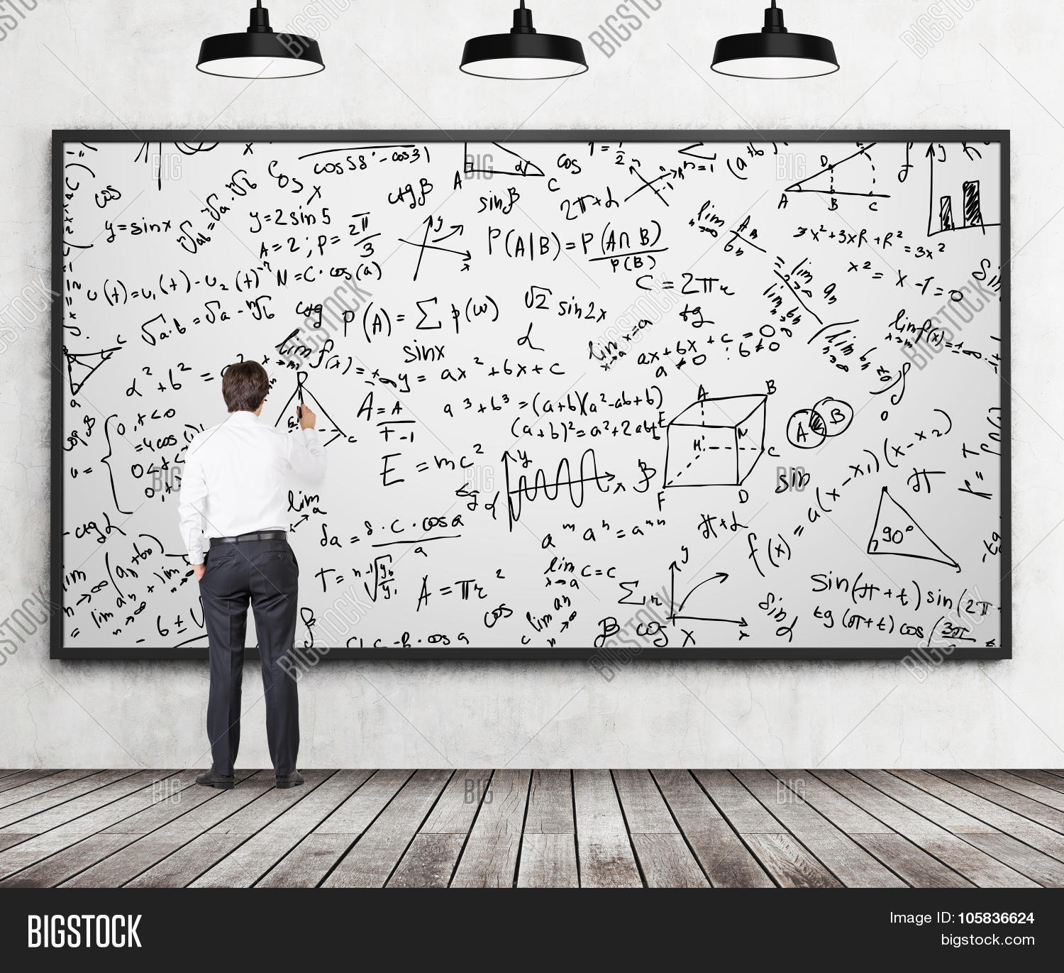 Rear View Of Young Professional Who Is Writing Down Math Formulas On ...
