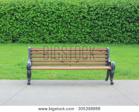 Park Bench On Warm Summer Day With No People Outdoors - Stock Image ...