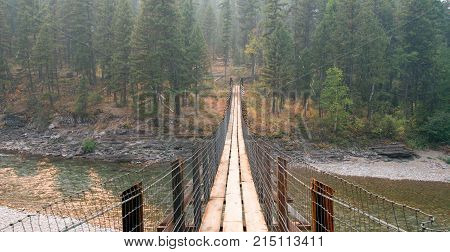 Suspension Plank And Wire Bridge Over The Flathead River At The Spotted ...