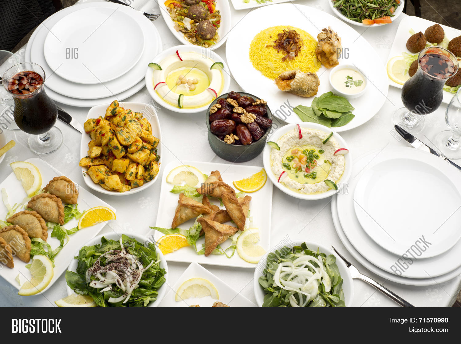 Arabic food of dates, hommos, cheese, labneh and fattoush served in ...