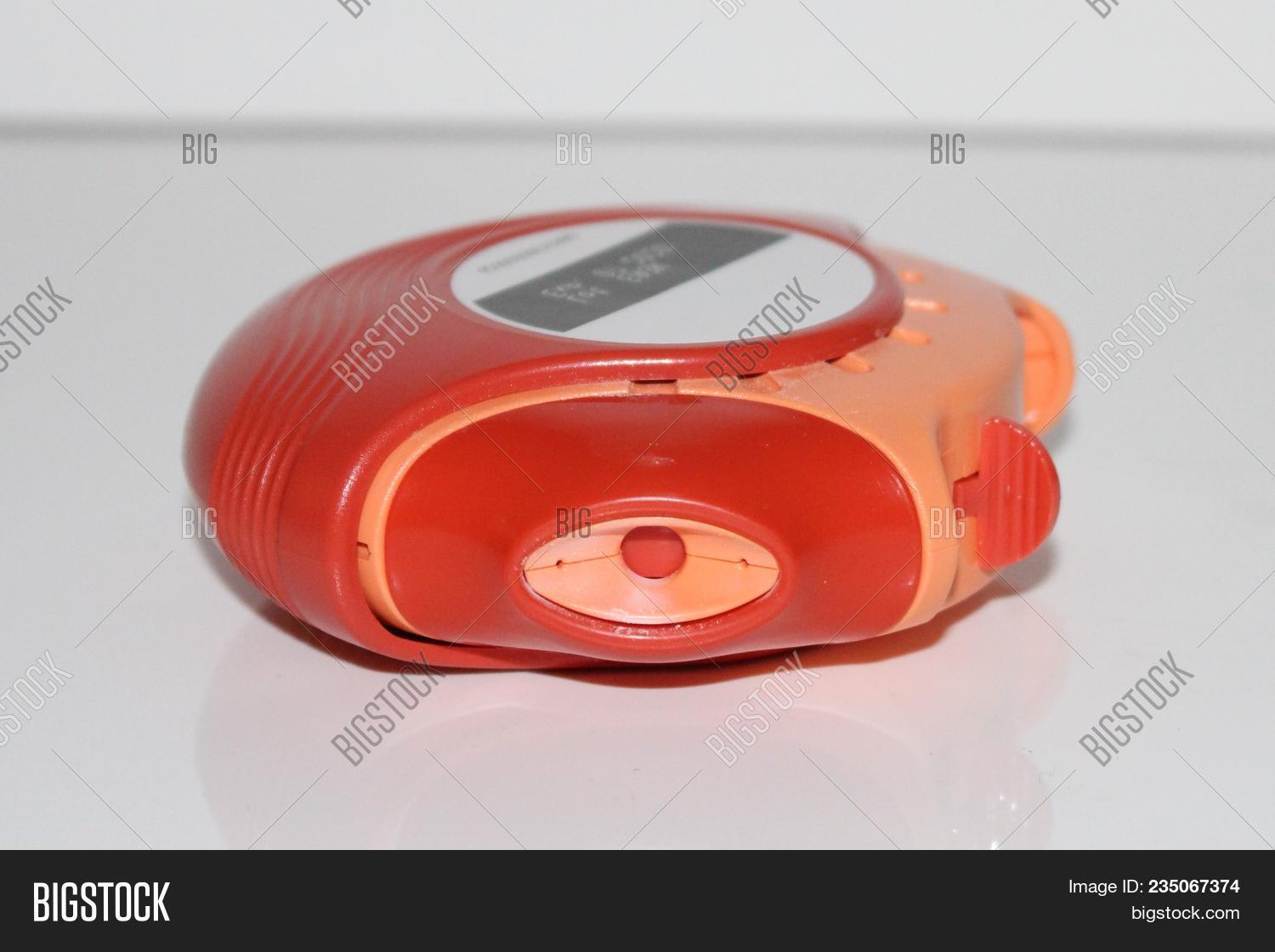 Asthma Inhaler. Metered Dose Inhaler. Orange Medication For Asthma ...