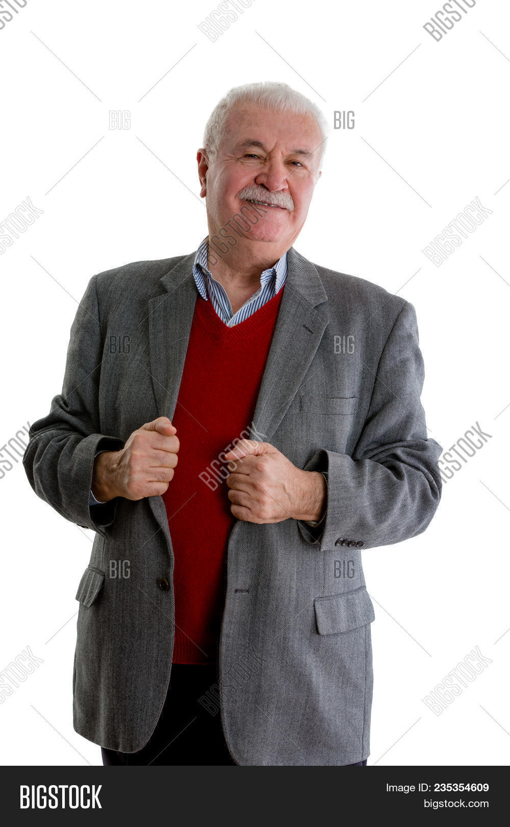 Suspicious Senior Man Looking Sceptically At The Camera As He Stands ...