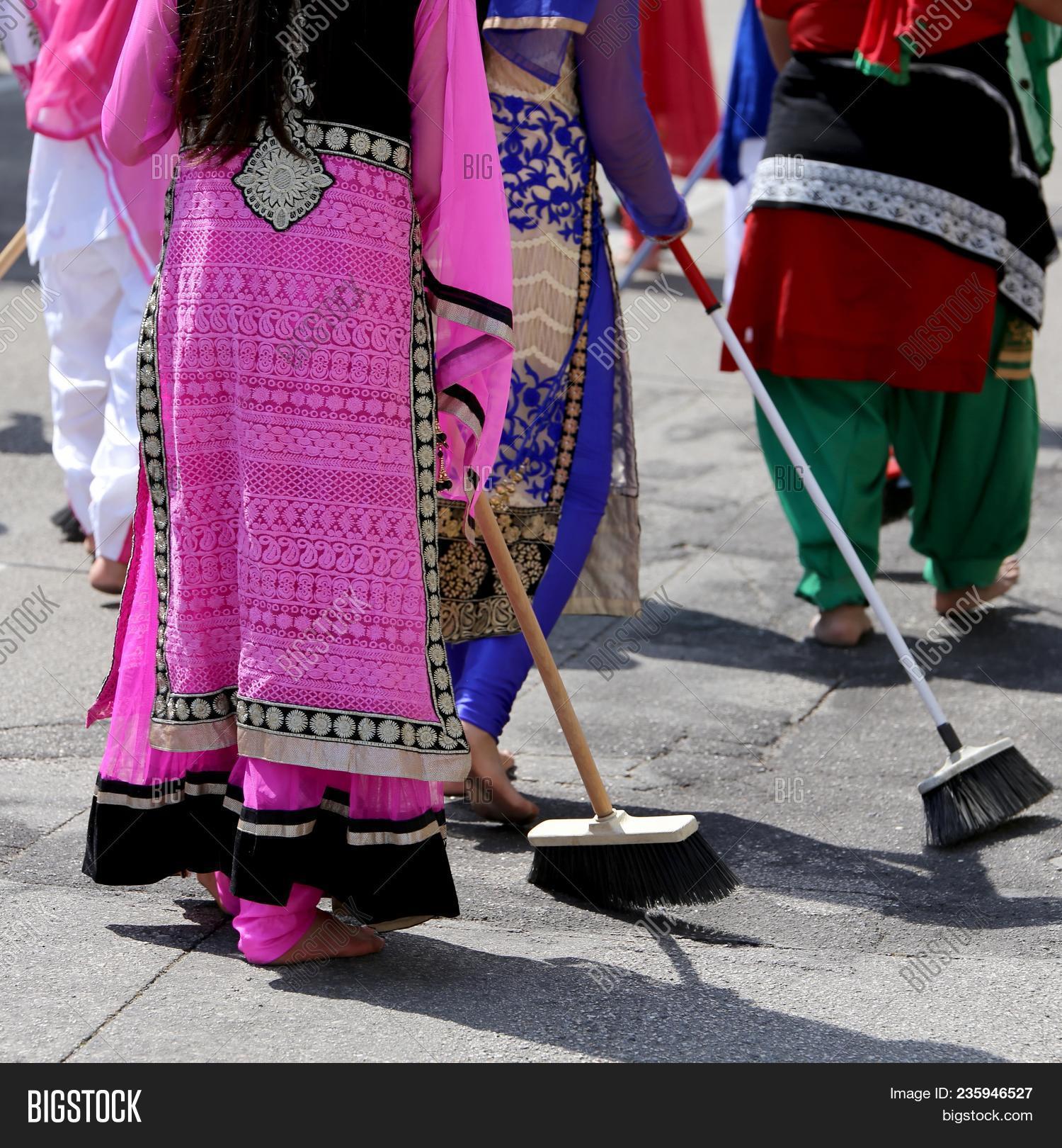 Sikh Women Barefoot While Scavenging The Road With A Broom During A ...