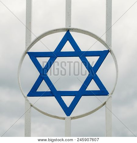 Blue Star Of David, The Judaic Religion Symbol On A Gate Against A ...